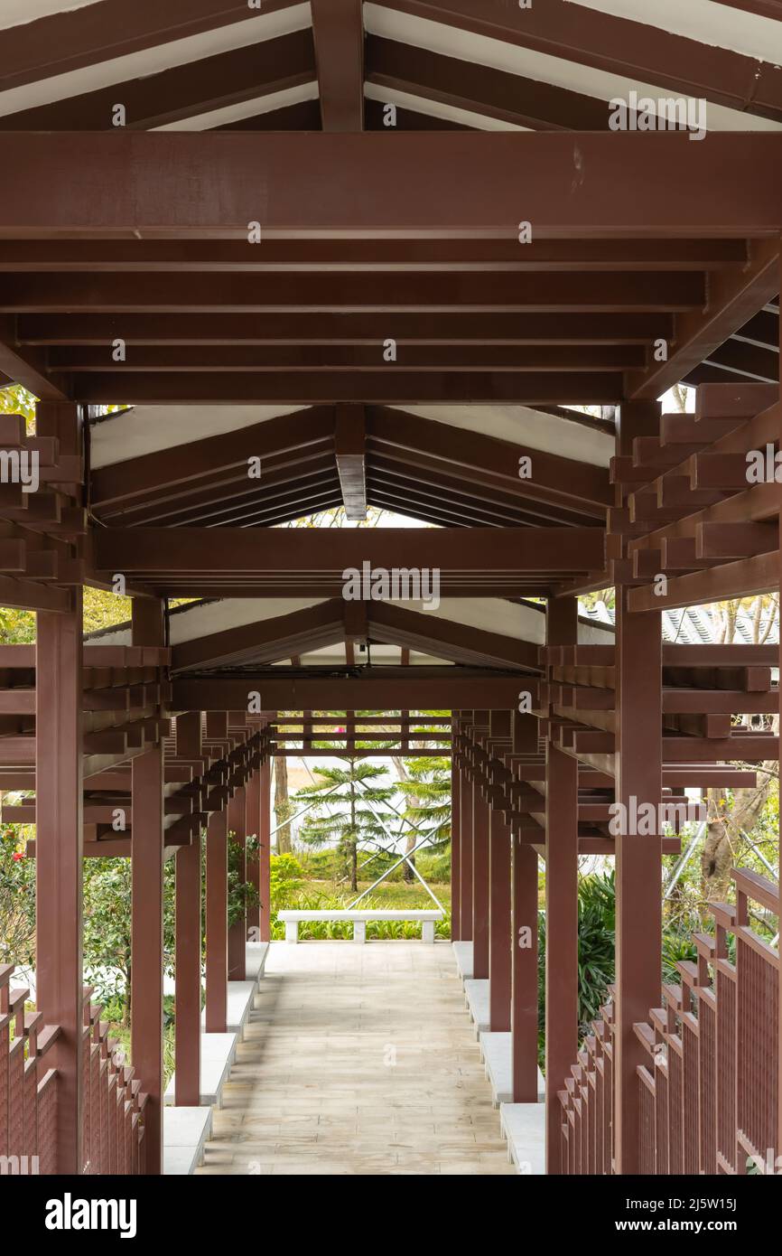 pathway with wooden roofs vertical composition Stock Photo - Alamy