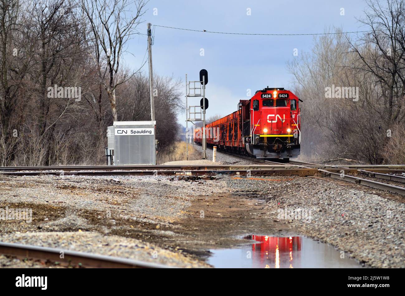 Elgin, Illinois, USA. A Canadian National Railway locomotive reflects ...