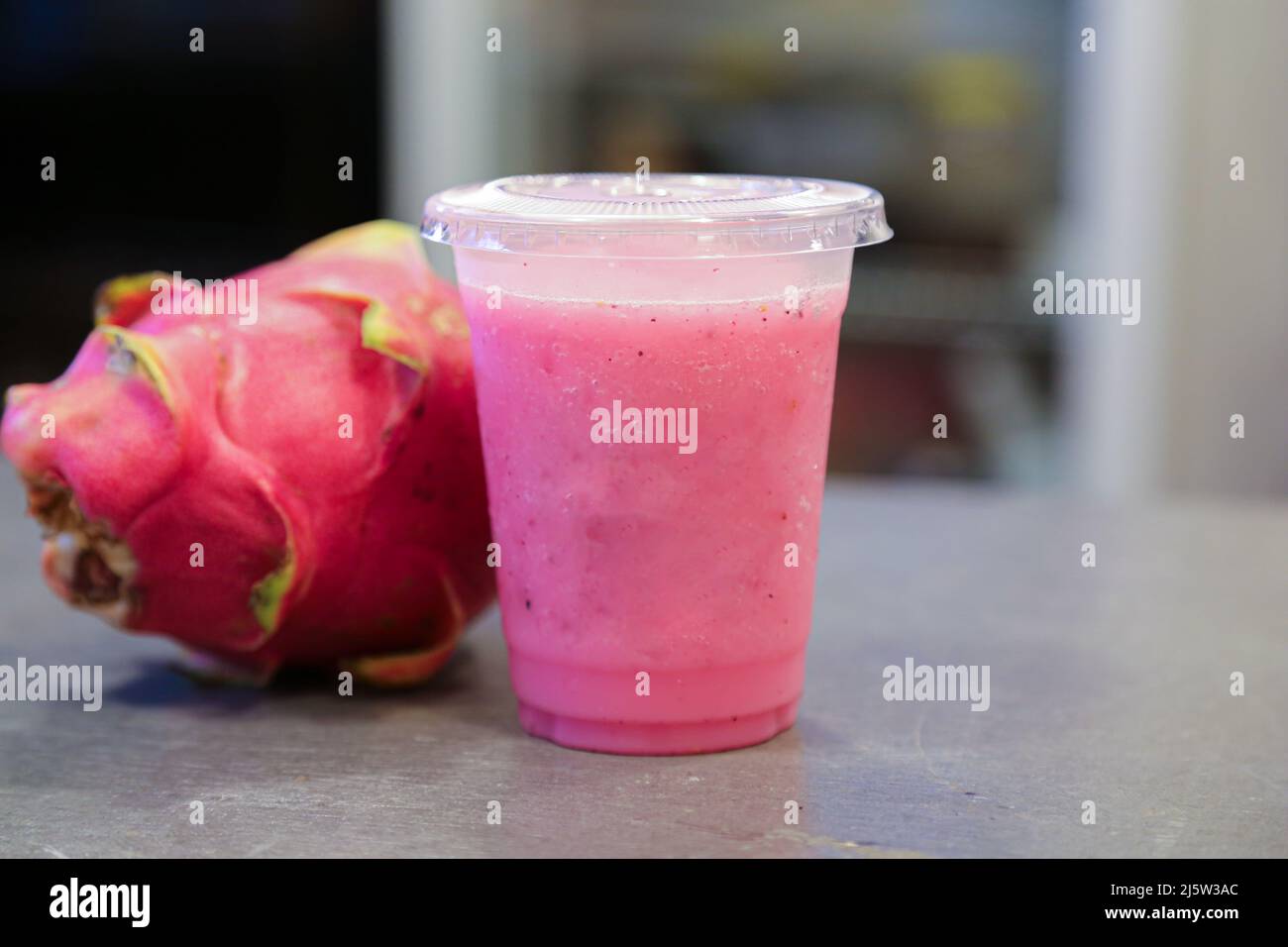 Dragon fruit pitaya juice in plastic cup Stock Photo - Alamy