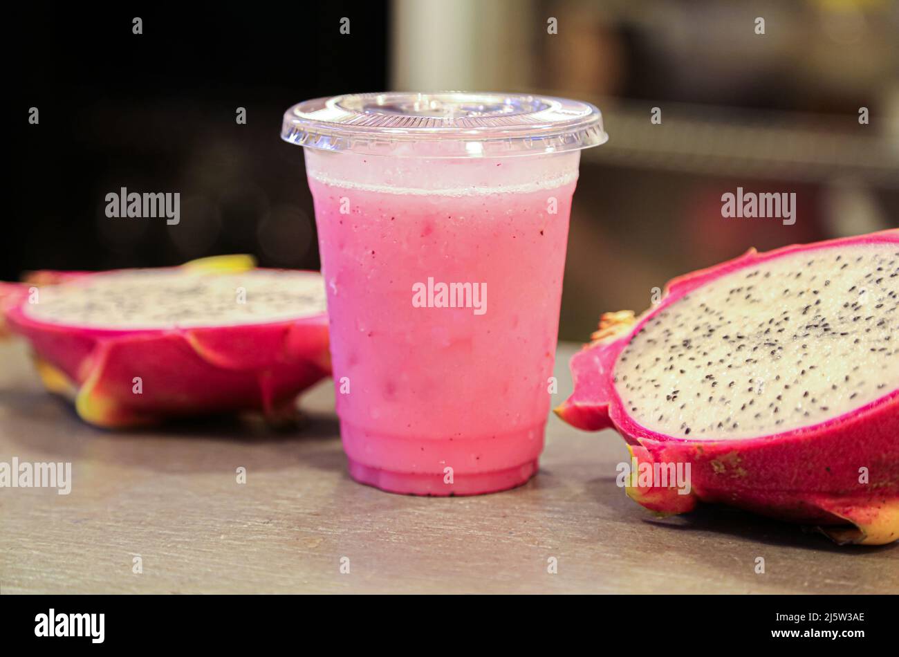Dragon fruit pitaya juice in plastic cup Stock Photo - Alamy