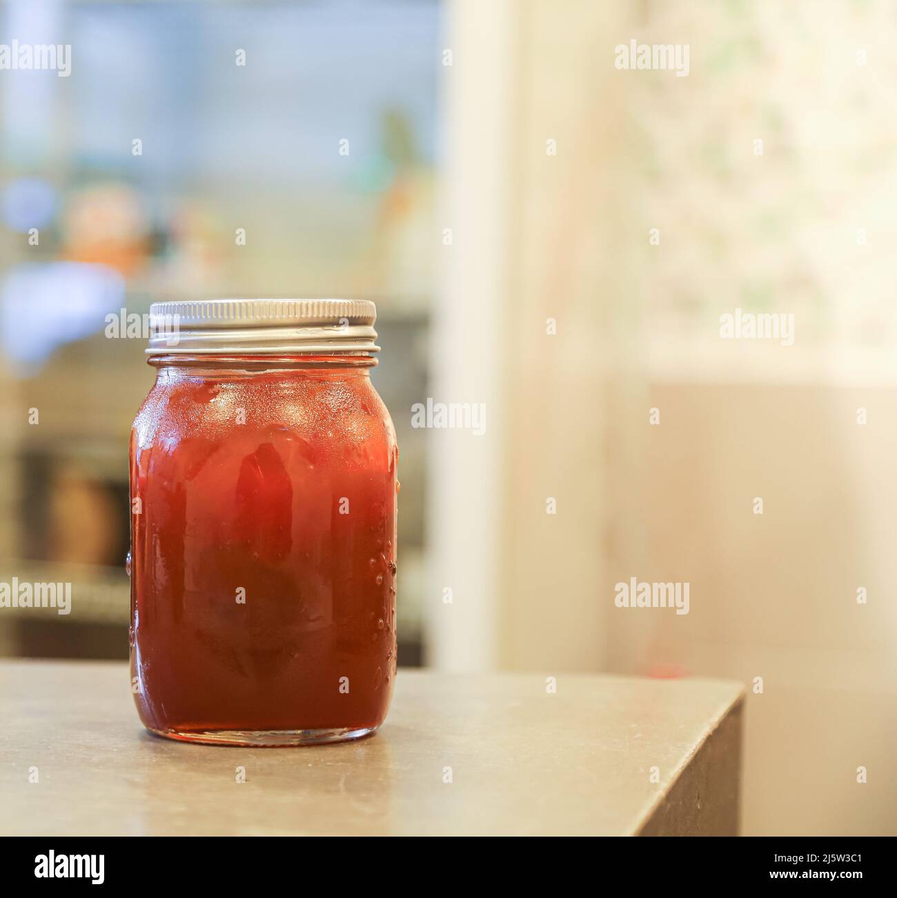 Iced tea in glass jar with lid on kitchen countertop Stock Photo - Alamy
