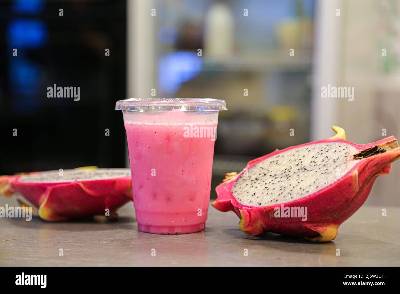 Dragon fruit pitaya juice in plastic cup Stock Photo - Alamy