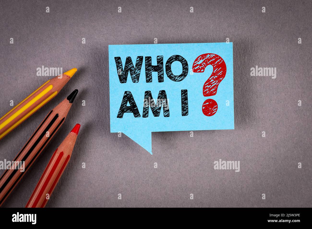 Who Am I. Blue speech bubble on a gray background Stock Photo - Alamy