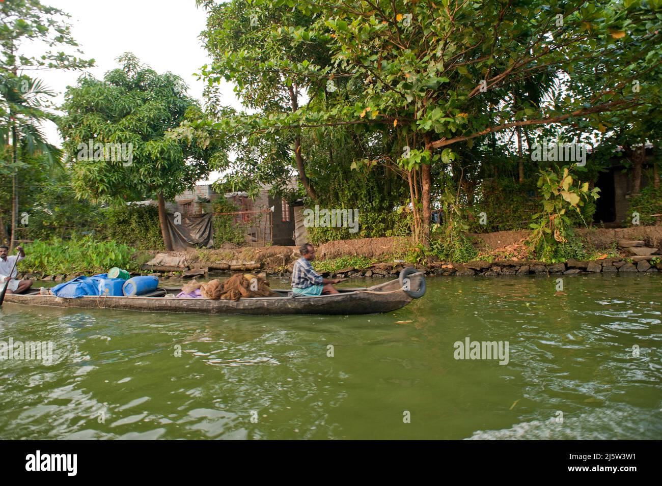 Fisherman with wooden canoes at Alappuzha state Kerala India Stock ...