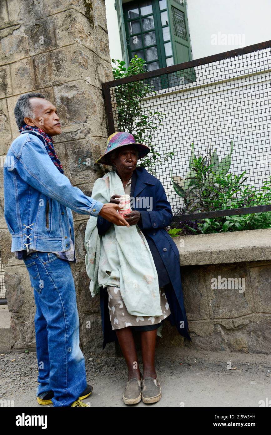 A Malagasy couple waiting for the bus in Antananarivo, Madagascar Stock ...