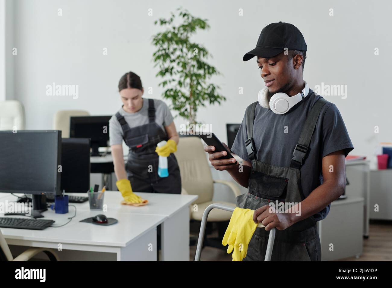 Male office cleaner black hi-res stock photography and images - Alamy