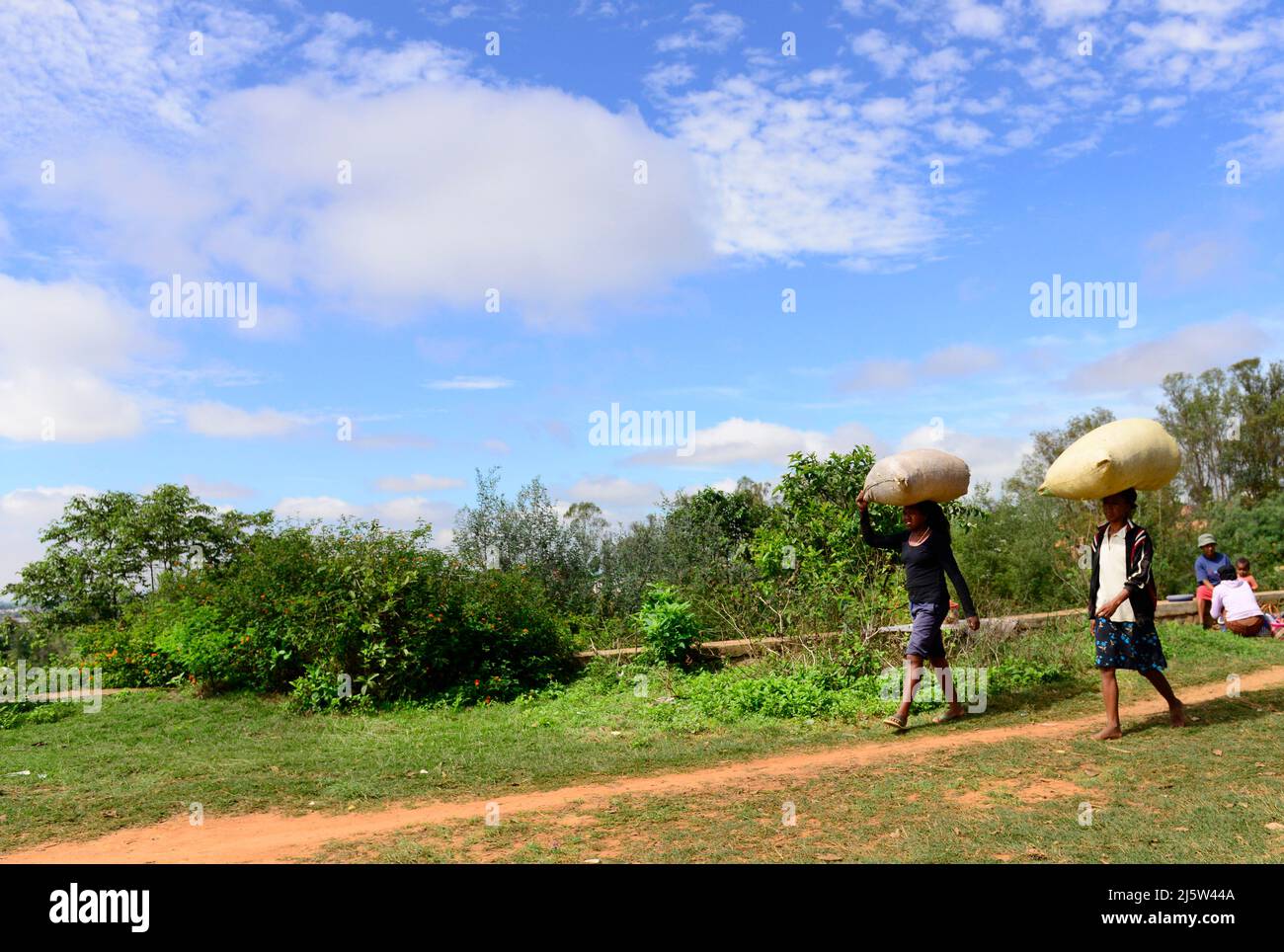 Woman carrying heavy bag hi-res stock photography and images - Alamy