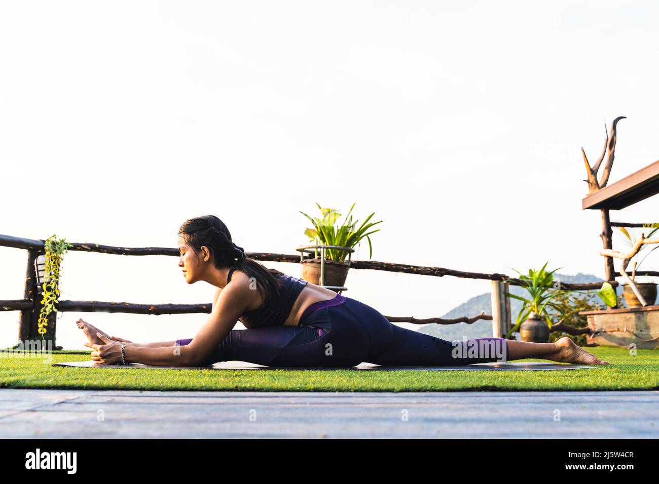 Thai woman doing morning yoga exercise at her home terrace Stock Photo ...