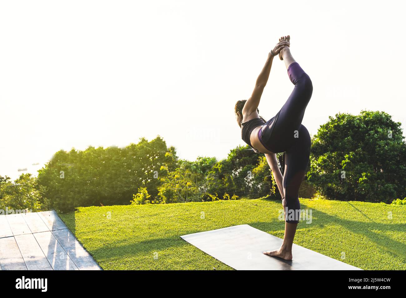 Thai woman doing morning yoga exercise at her home terrace Stock Photo ...