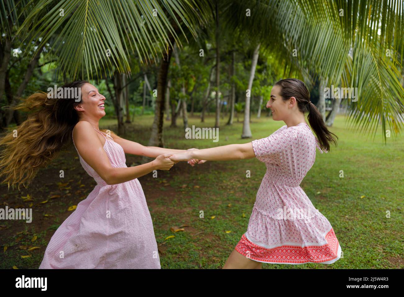 Woman spinning friends nature hi-res stock photography and images - Alamy