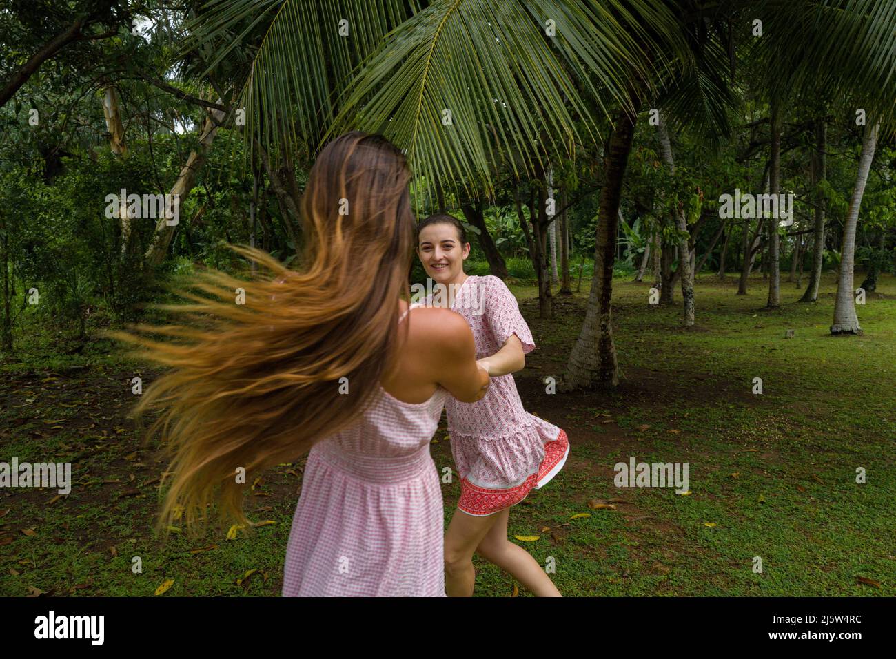 Woman spinning friends nature hi-res stock photography and images - Alamy