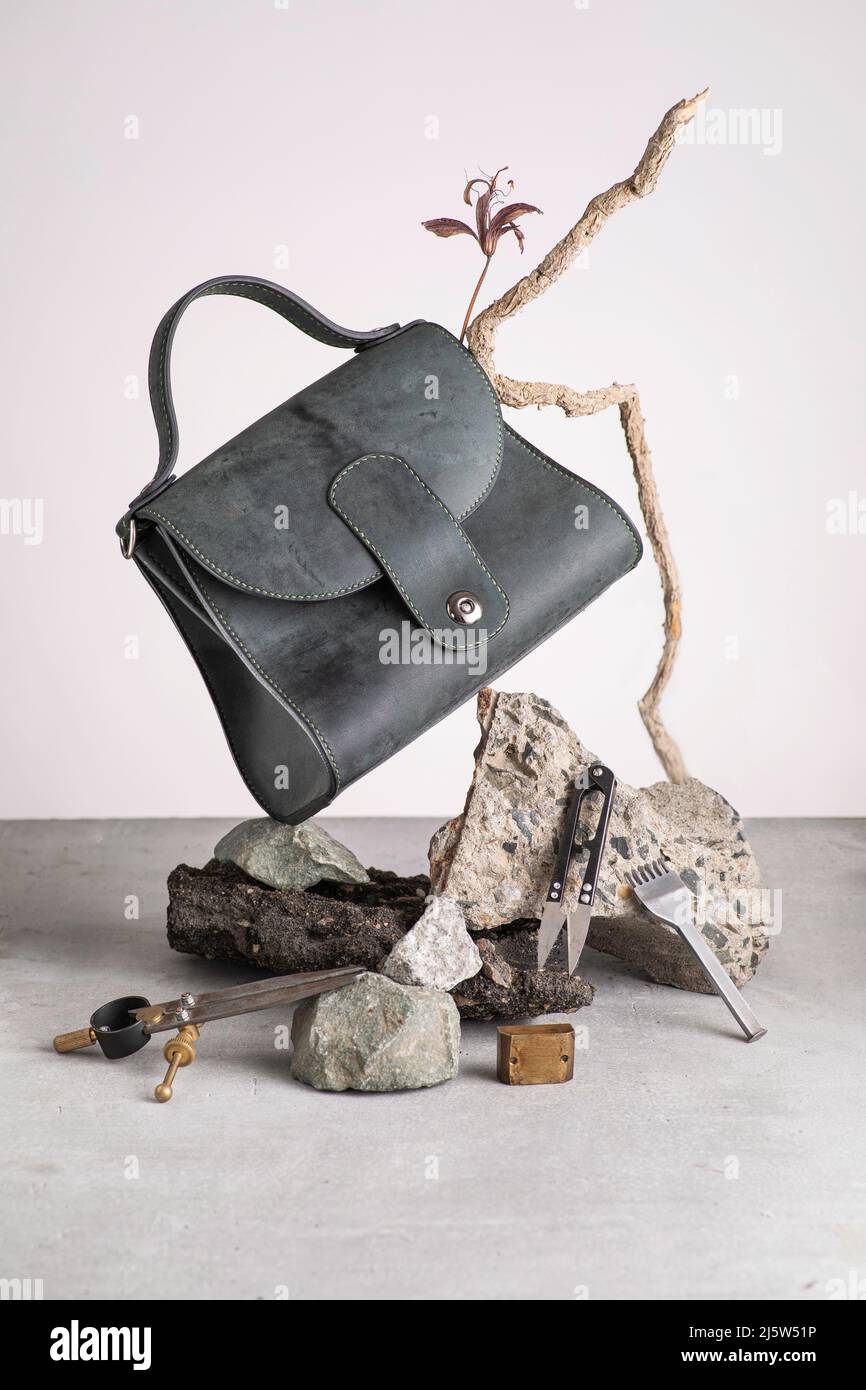 Still life with leather handbag and tools Stock Photo - Alamy