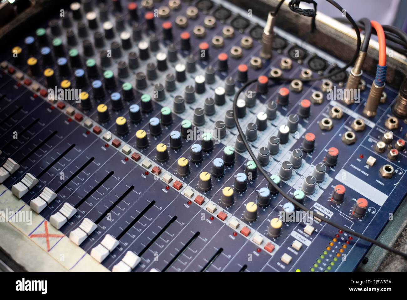 Sound mixer board using dj with buttons and controls Stock Photo - Alamy