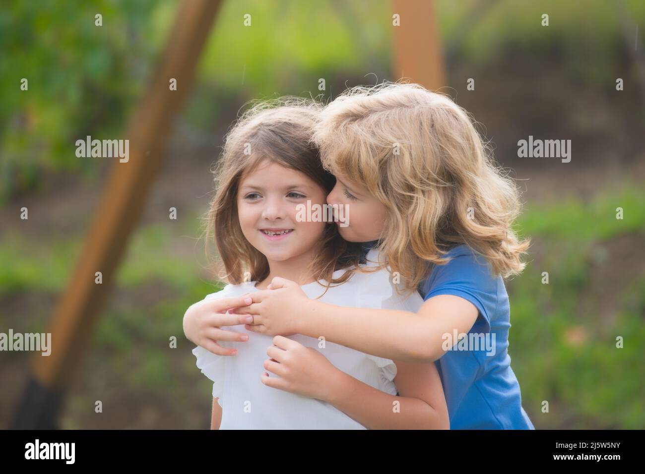 Little boy hugging shy girl, toddler boy embracing depressed little ...