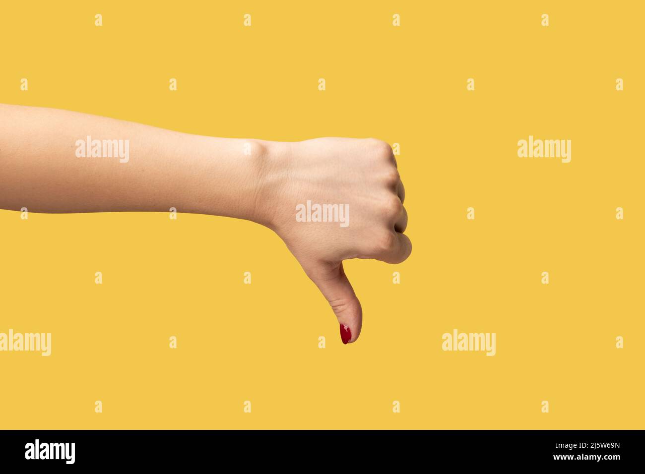 Closeup woman hand showing thumb down, rejection symbol, negative ...