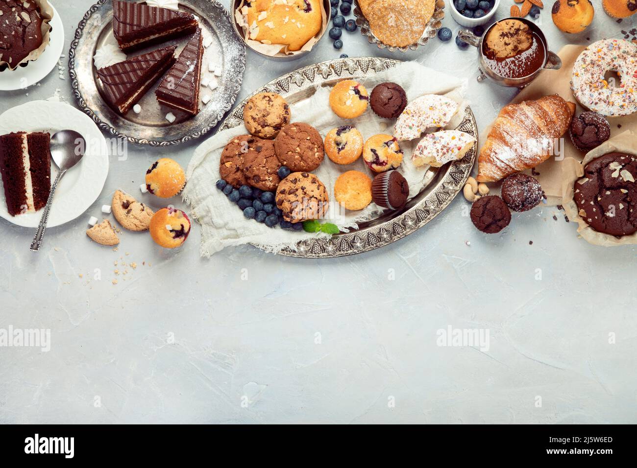 Dessert table with all kinds snacks on light background. Candy bar ...