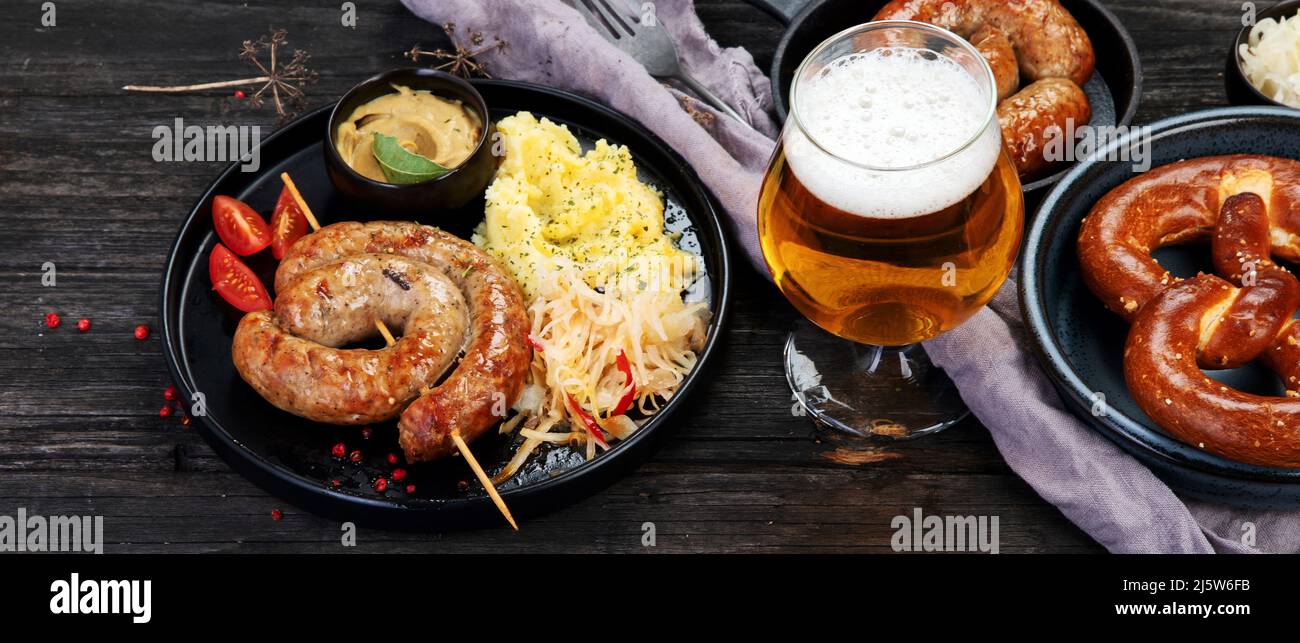Grilled German sausages on wooden background. Traditional food concept ...