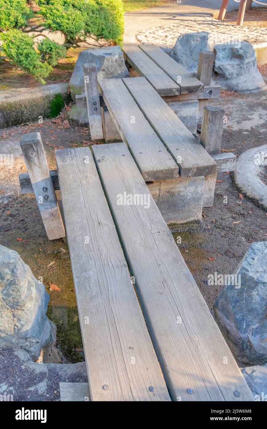 Diagonal wooden planks bridge at Japanese Friendship Garden in San Jose ...