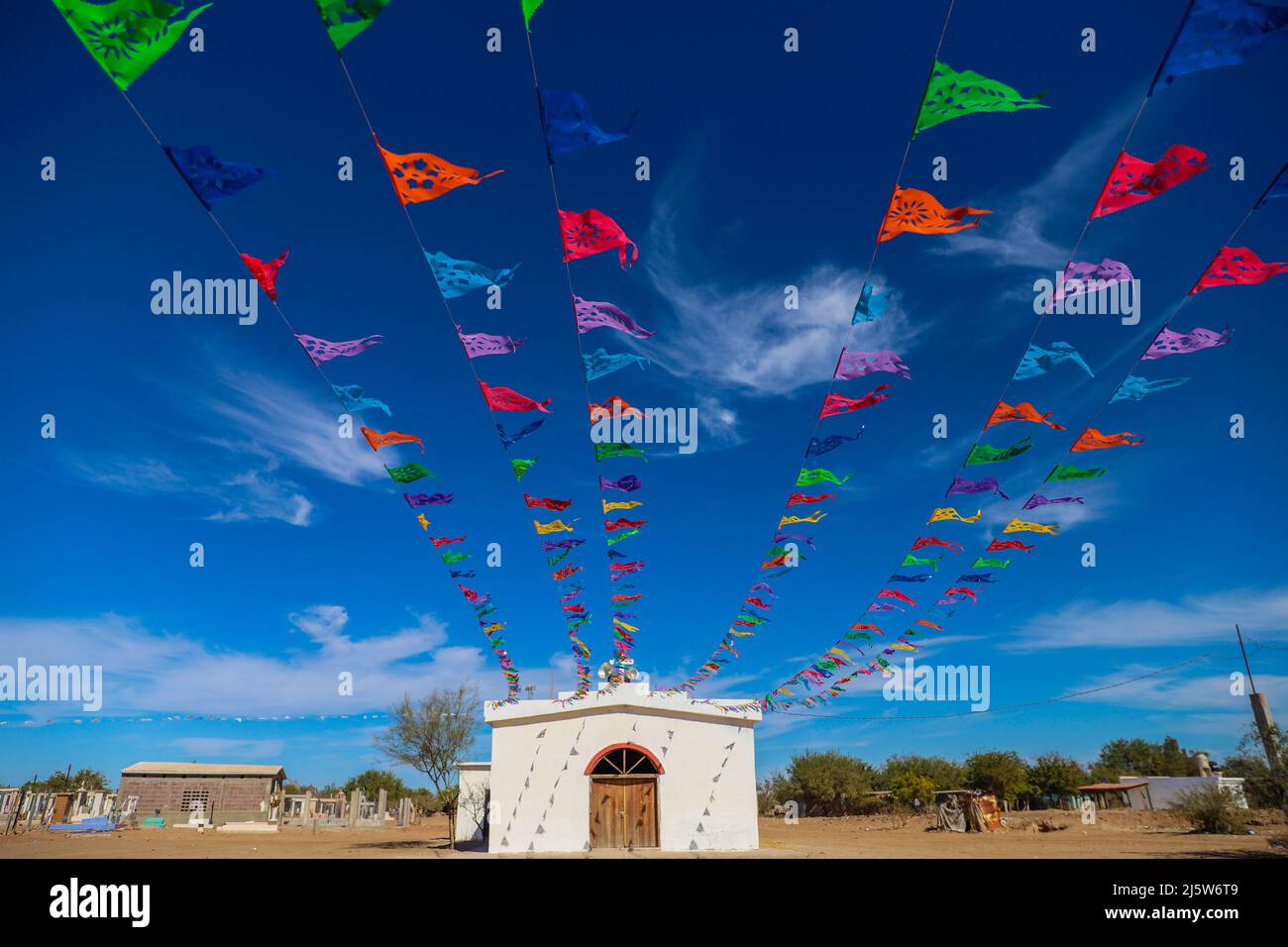 Church and colored papel picado flags typical of the Day of the Dead or ...