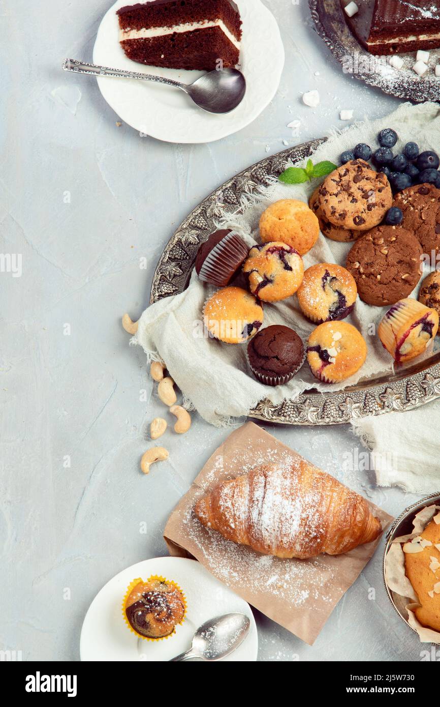 Dessert table with all kinds snacks on light background. Candy bar ...
