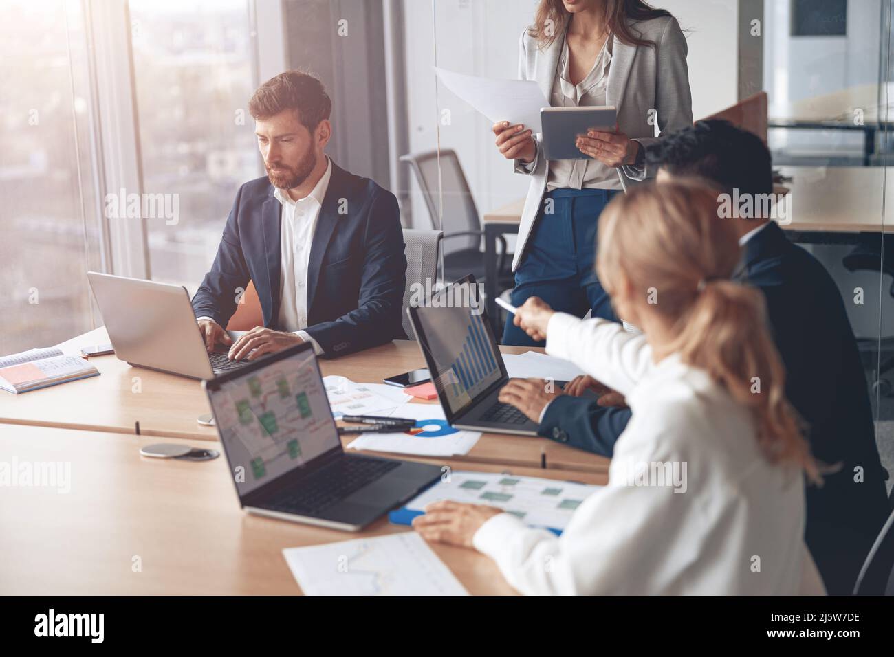 Office colleagues casual discussion during hi-res stock photography and ...