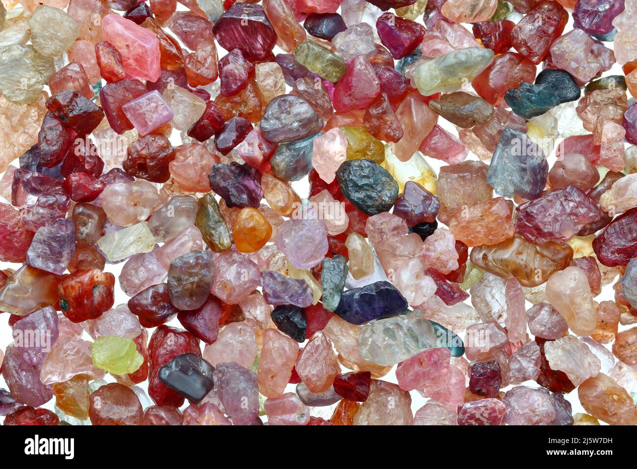 Closeup natural rough fancy spinel gemstone background Stock Photo - Alamy