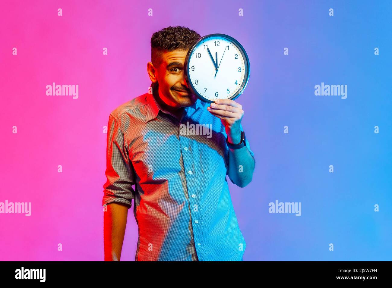 Isolated man hiding face with clock hi-res stock photography and images ...