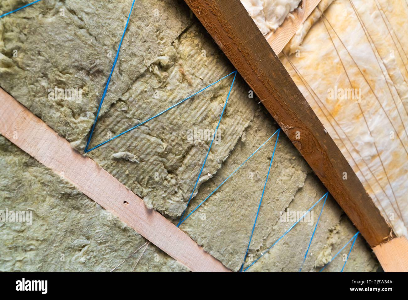 The process of roof insulation with glass wool and mineral wool Stock ...