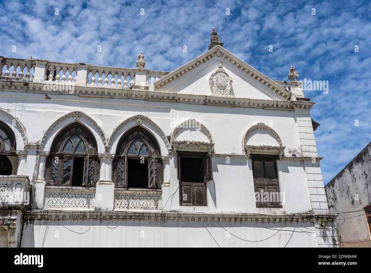 Detail of a white building on a street in Stone Town at sunny day of ...