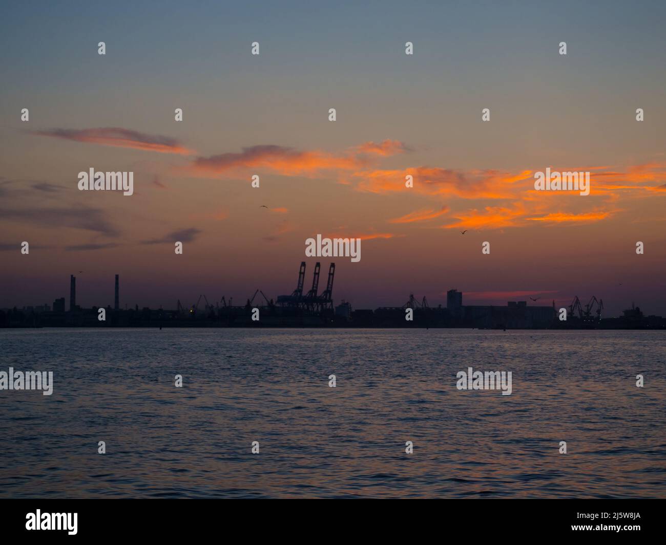 black sea port Odesa, Ukraine with a lot of cranes, cabins, boxes and ...