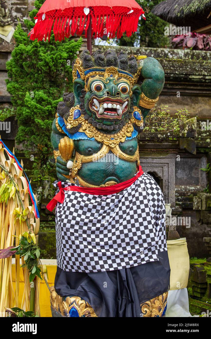 Traditional Balinese demon statue in the street temple. Island Bali ...
