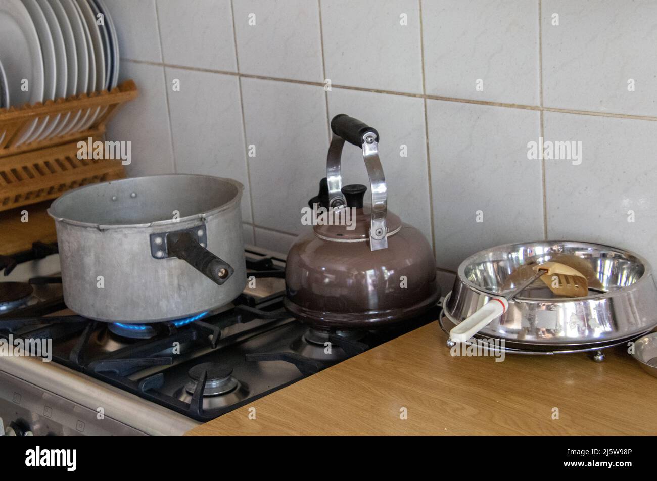 Cooking on a LPG gas stove in a modern kitchen Stock Photo - Alamy