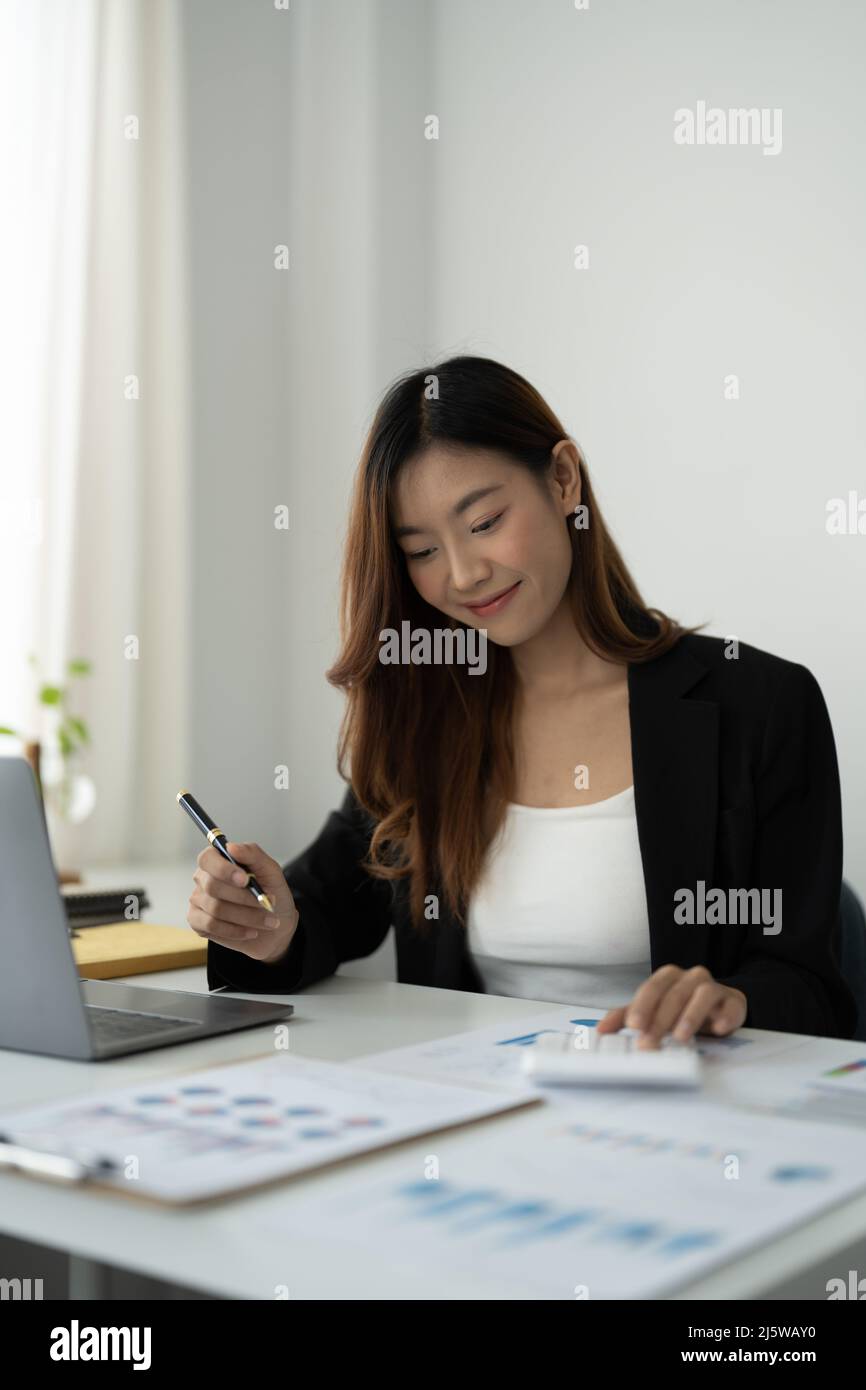 Business woman calculating companys hi-res stock photography and images ...