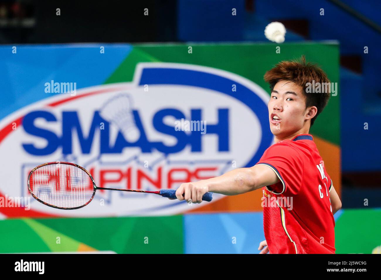 Manila. 26th Apr, 2022. Weng Hongyang of China hits a return during the ...