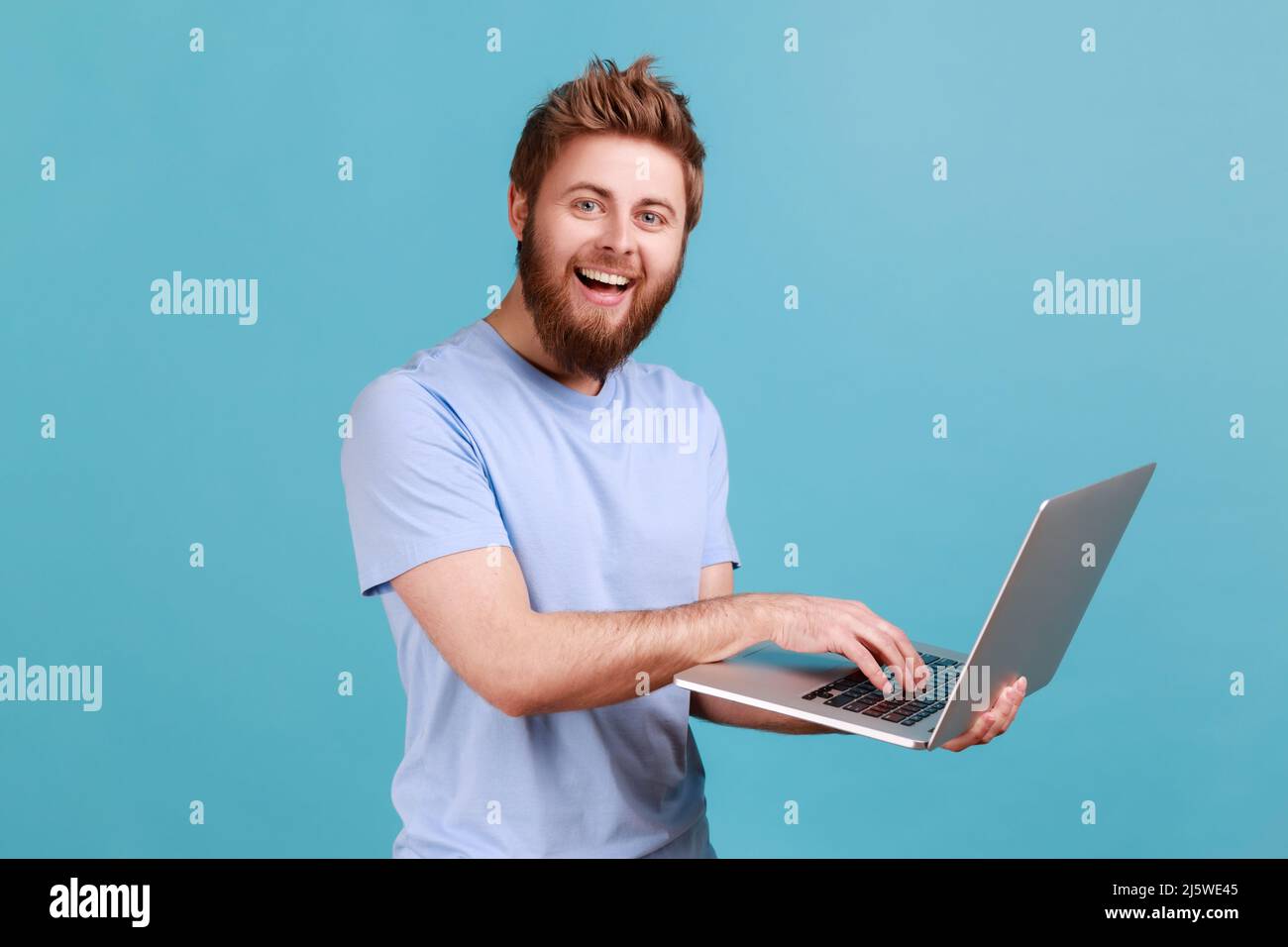 Bearded man laptop smiling camera hi-res stock photography and images ...