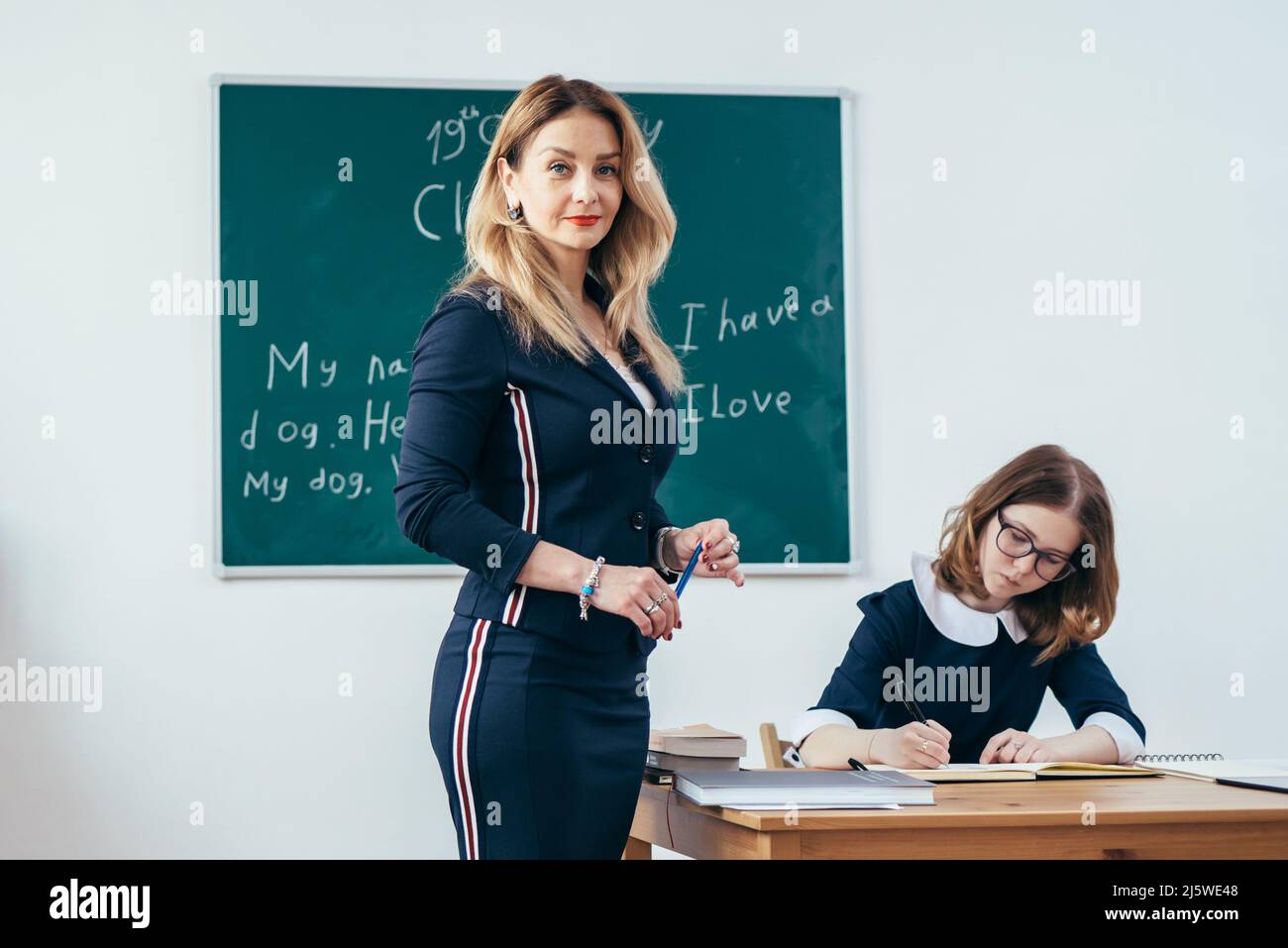 Female teacher at school hi-res stock photography and images - Alamy