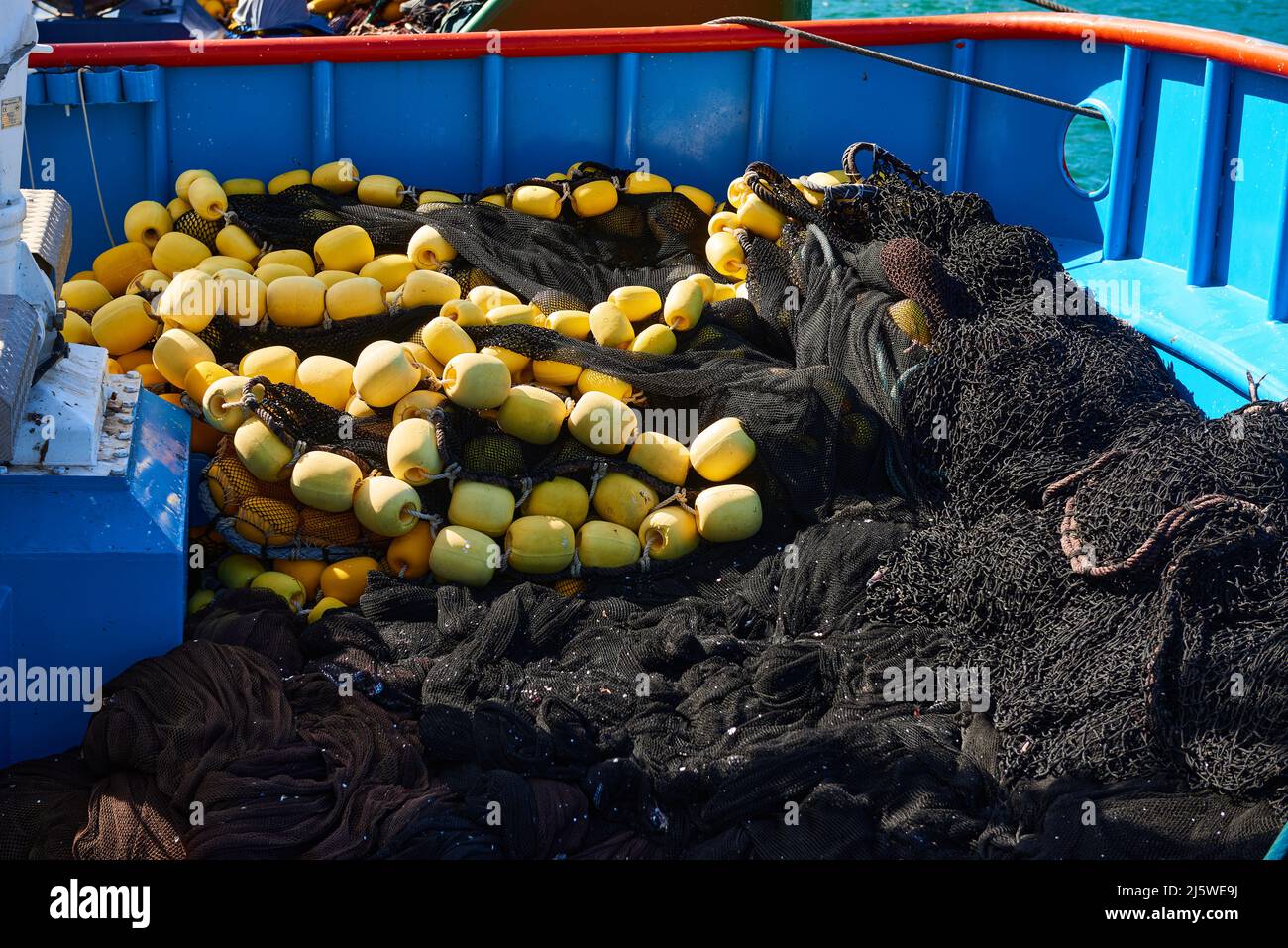 Fishing net inside a fishing boat Stock Photo - Alamy