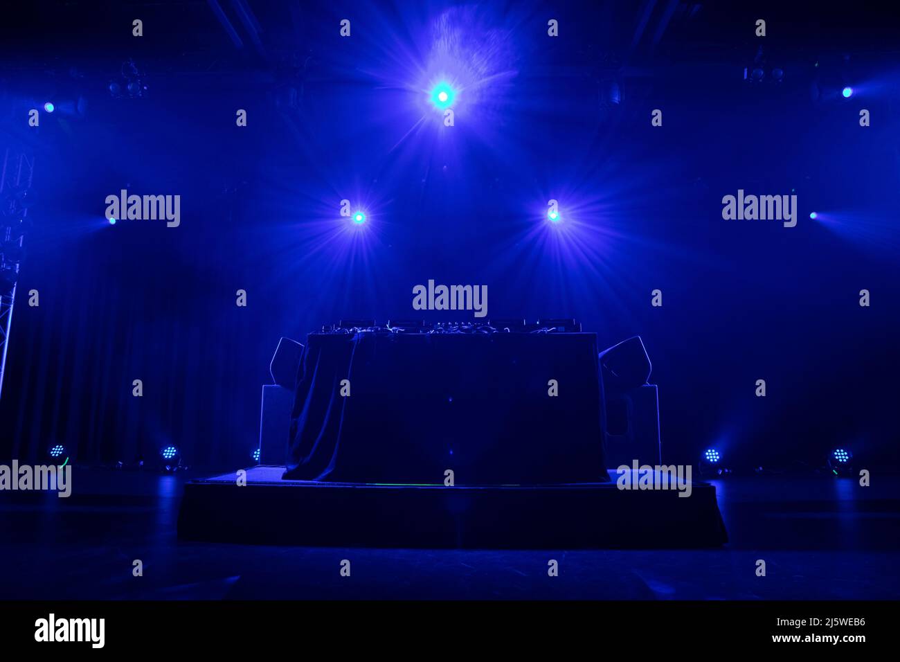 Dj Booth set up on stage with aesome lighting Stock Photo - Alamy
