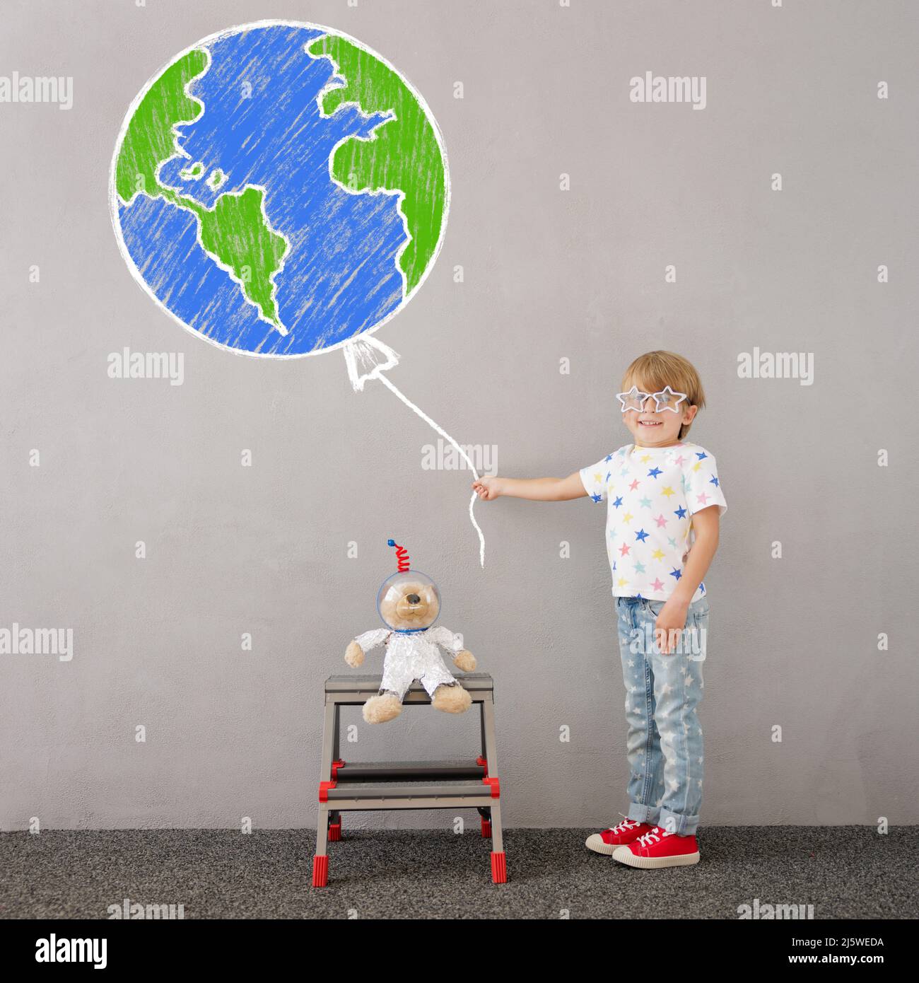 Happy child playing with teddy bear at home. Kid pretend to be ...