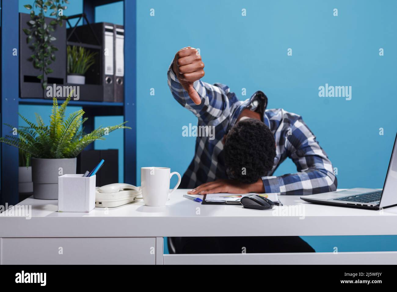 Overworked employee showing timeout gesture hi-res stock photography ...