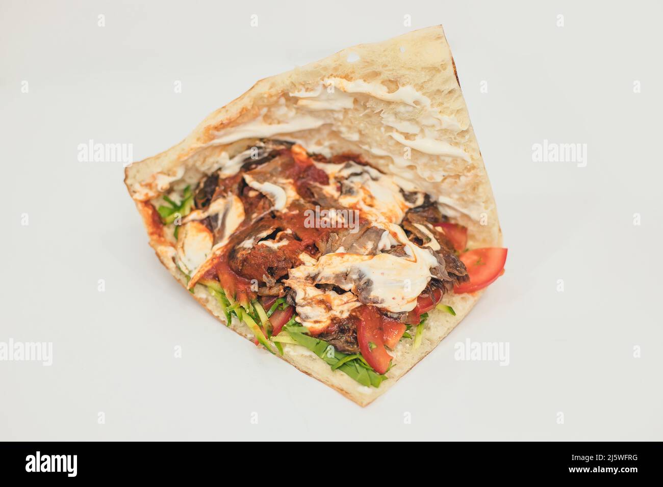 doner or shawarma in a Central Asian flatbread on a white background ...