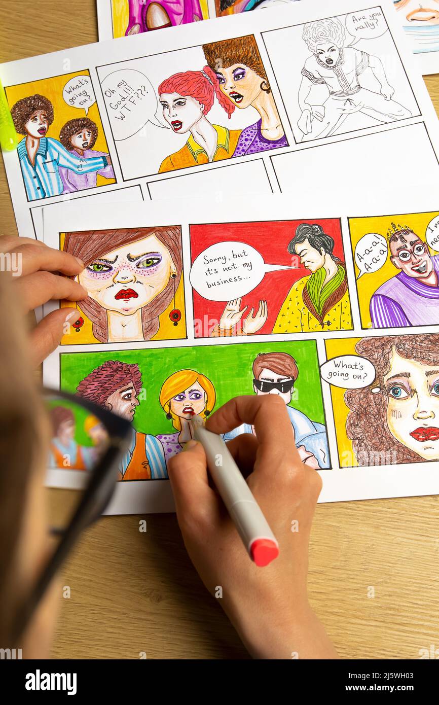 The artist designer draws sketches of comic book characters on paper ...