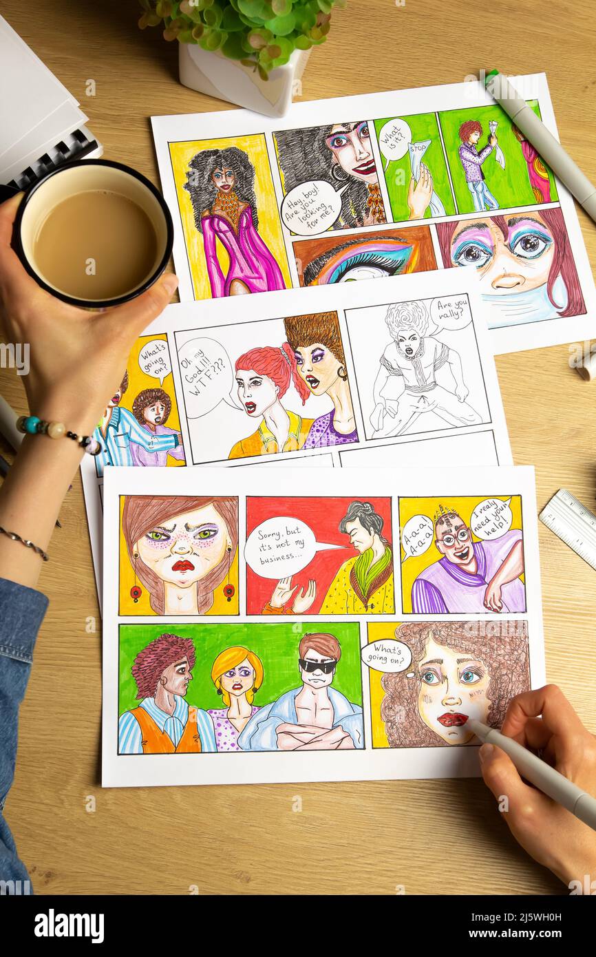 The artist designer draws sketches of comic book characters on paper ...