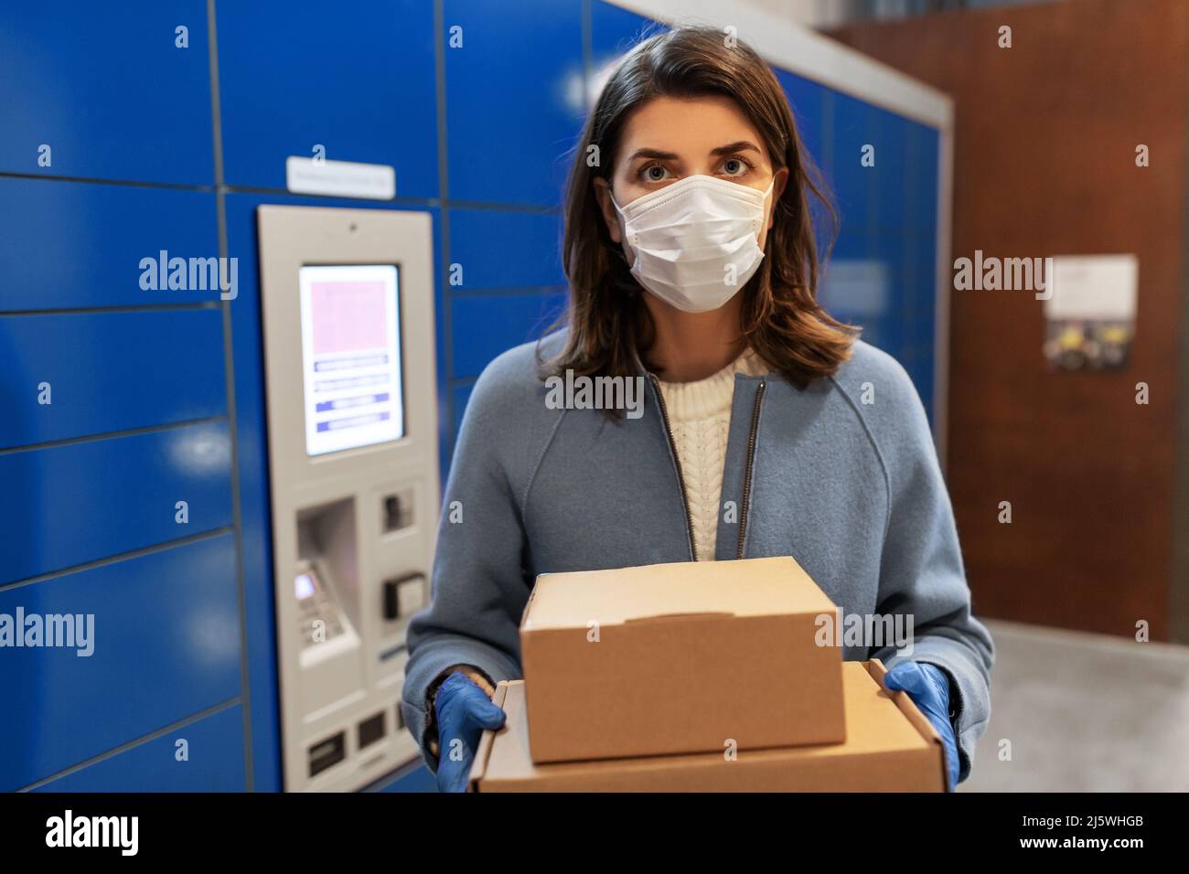 Woman boxes automated parcel hi-res stock photography and images - Alamy