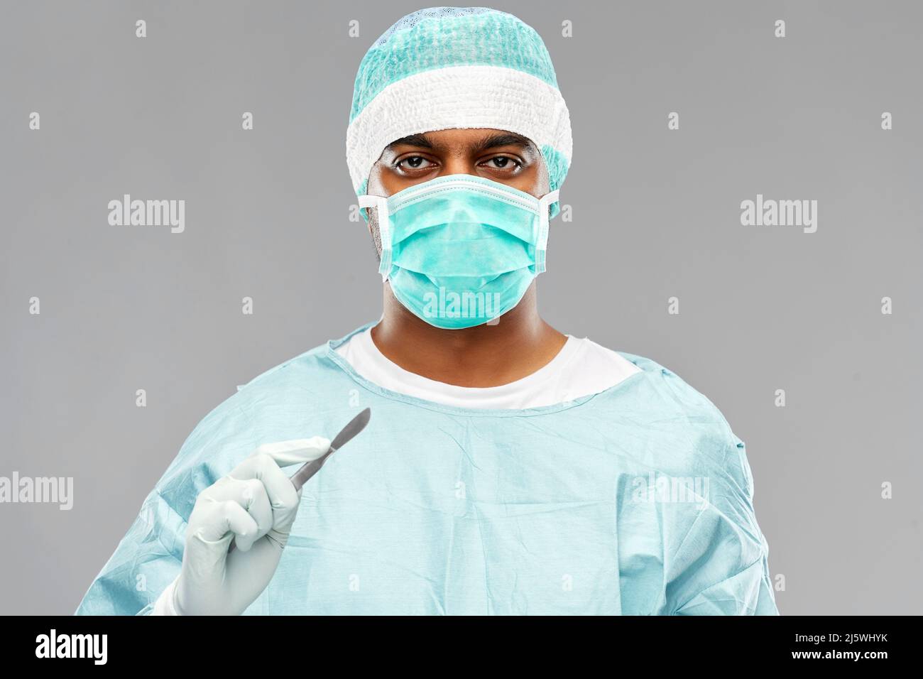 indian male doctor or surgeon with scalpel Stock Photo - Alamy