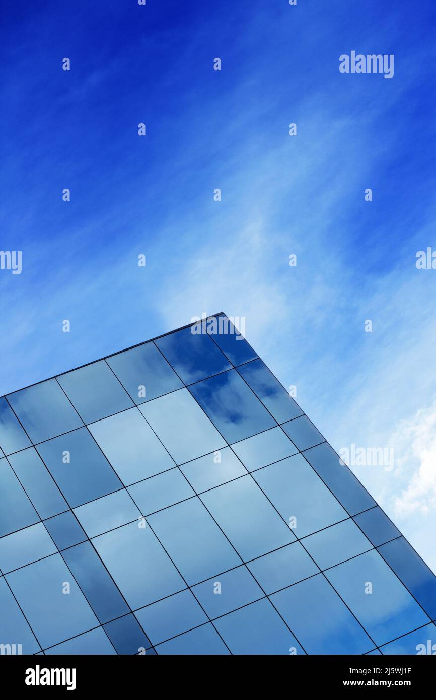 architectural composition of pointed glass facade with blue ceilings ...