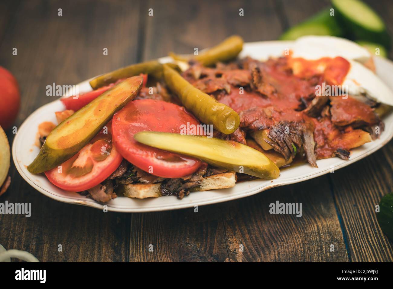 turkish national food iskender or iskender kebab with yogurt and herbs ...