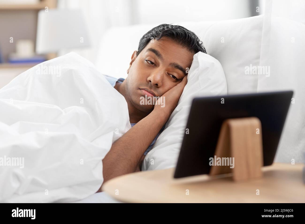 Indian man at home looking at computer hi-res stock photography and ...