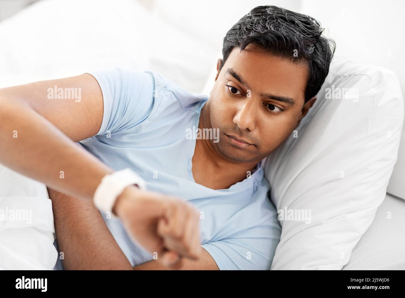 Man looking at watch hi-res stock photography and images - Alamy