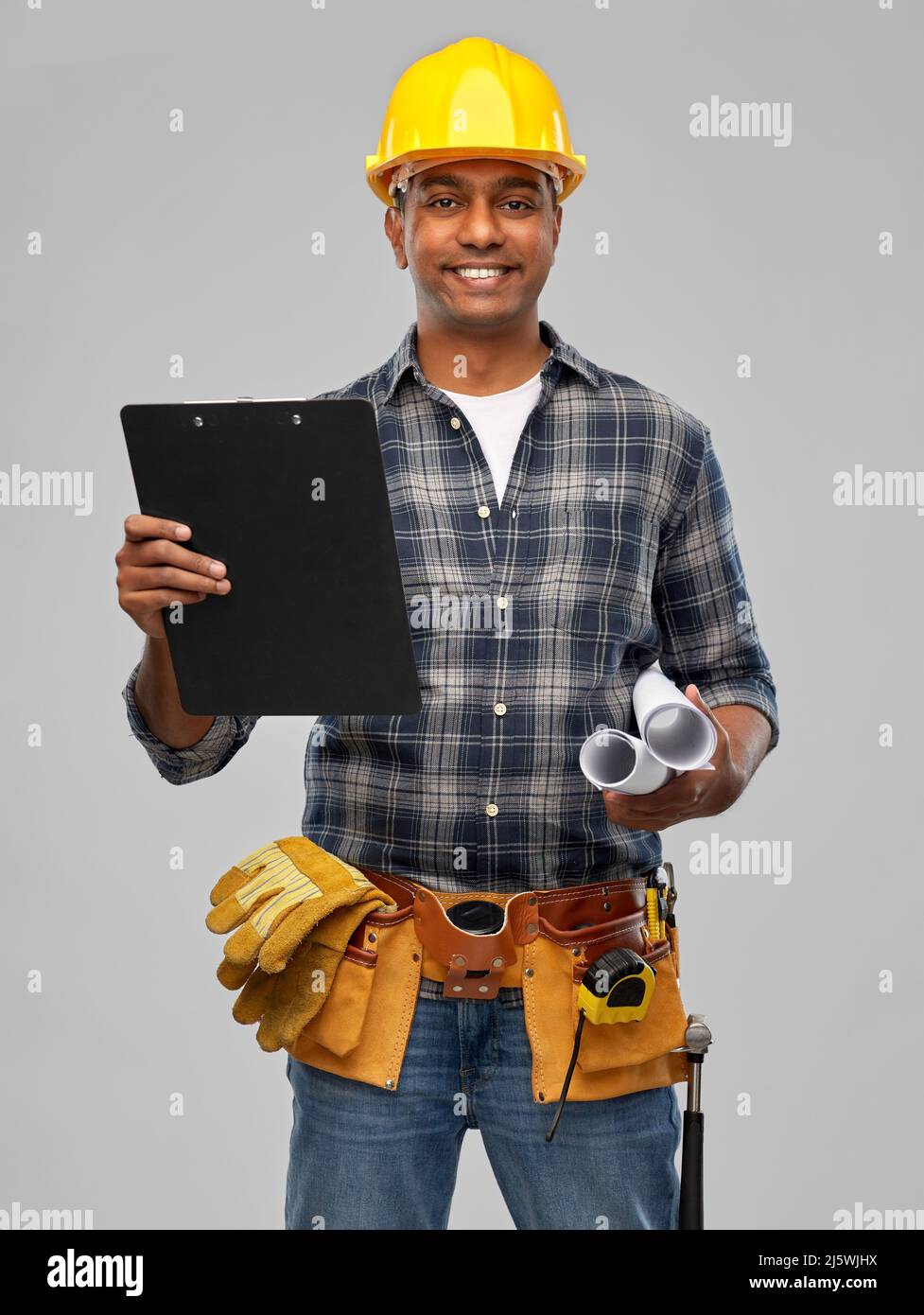 happy indian builder with blueprint and clipboard Stock Photo - Alamy